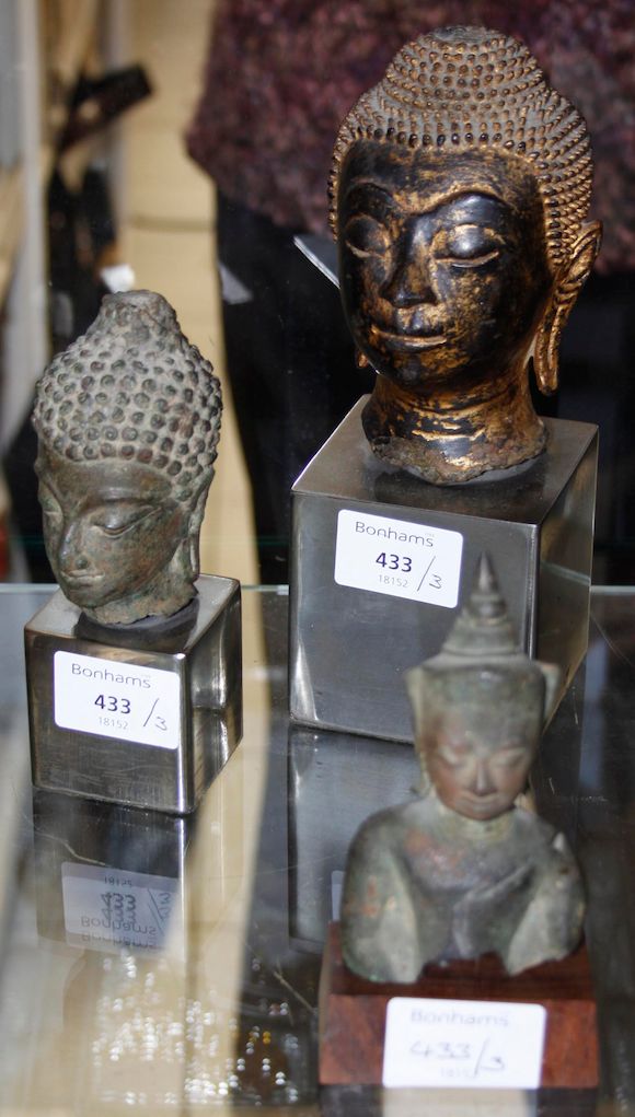 Bonhams : A small collection of three South East Asian bronze heads