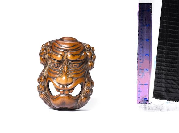 Bonhams : A boxwood mask netsuke By Konan Minko, early 19th century