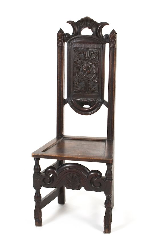 Bonhams : An oak high-back side chair, with 16th Century Romayne panel back