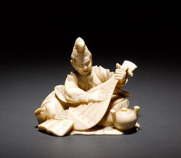 Bonhams : An ivory okimono, carved as a seated musician with a stringed ...