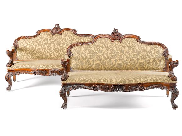 Bonhams : A pair of early Victorian rococo revival carved oak sofas