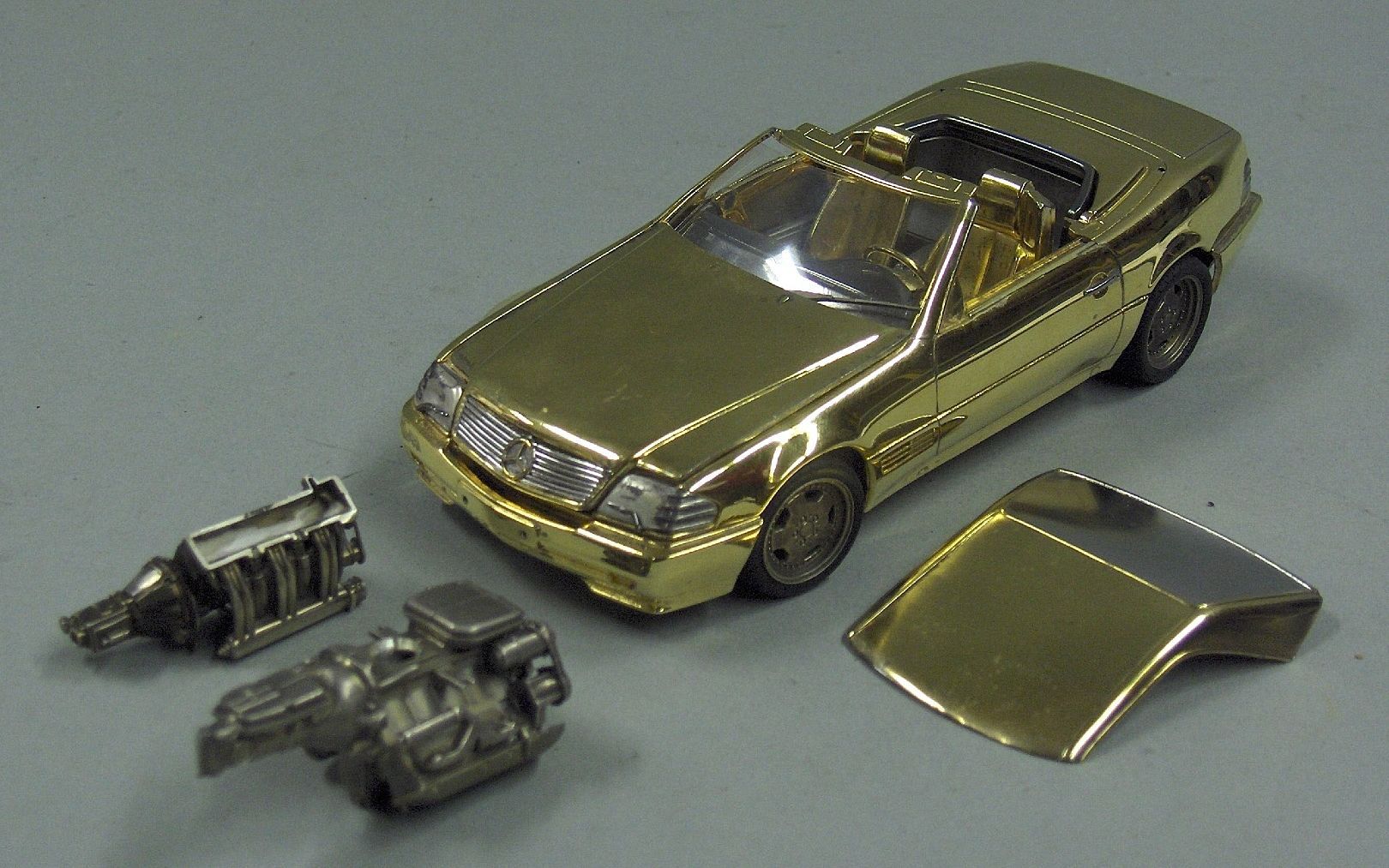 Bonhams Cars : A solid gold and silver Mercedes-Benz 500SL Coupe,