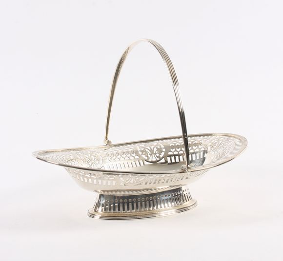 Bonhams : A silver swing-handled cake basket By Stephenson & Sons ...
