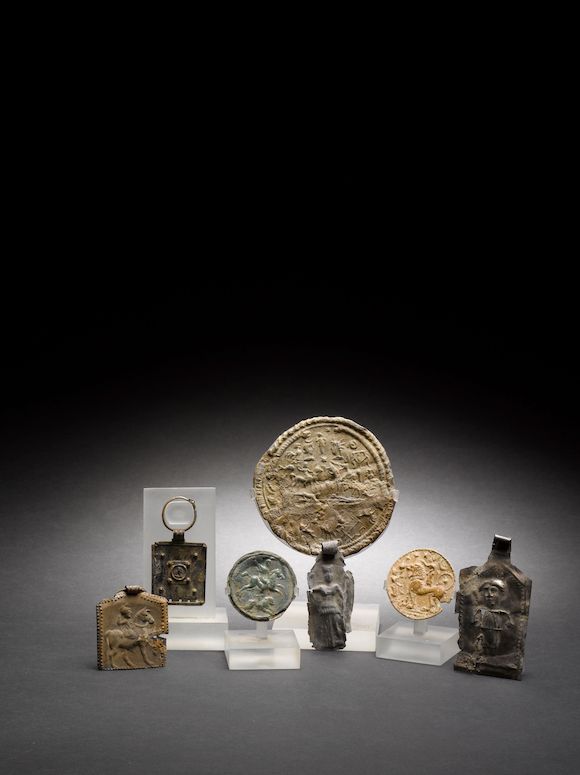 Bonhams : Three Roman lead and bronze roundels a lead roundel and ...