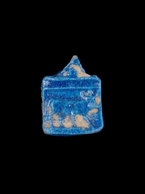 Bonhams : An Egyptian deep blue glazed composition pectoral amulet