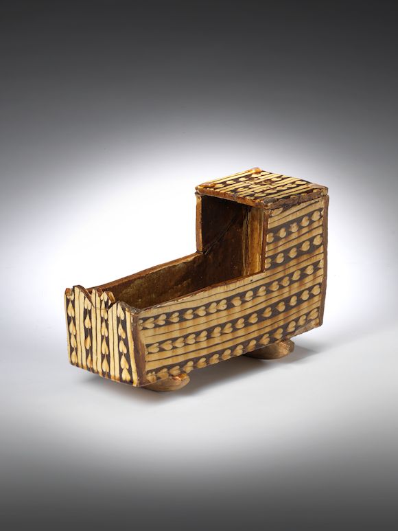 Bonhams : A rare slipware cradle, dated 1768