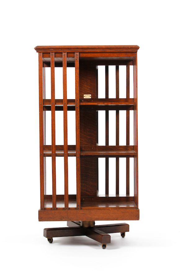 Bonhams : An oak revolving bookcase, early 20th Century Bearing ivorine ...