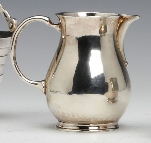 Bonhams : A George II sparrow beak cream jug by Thomas Mason, London 1725