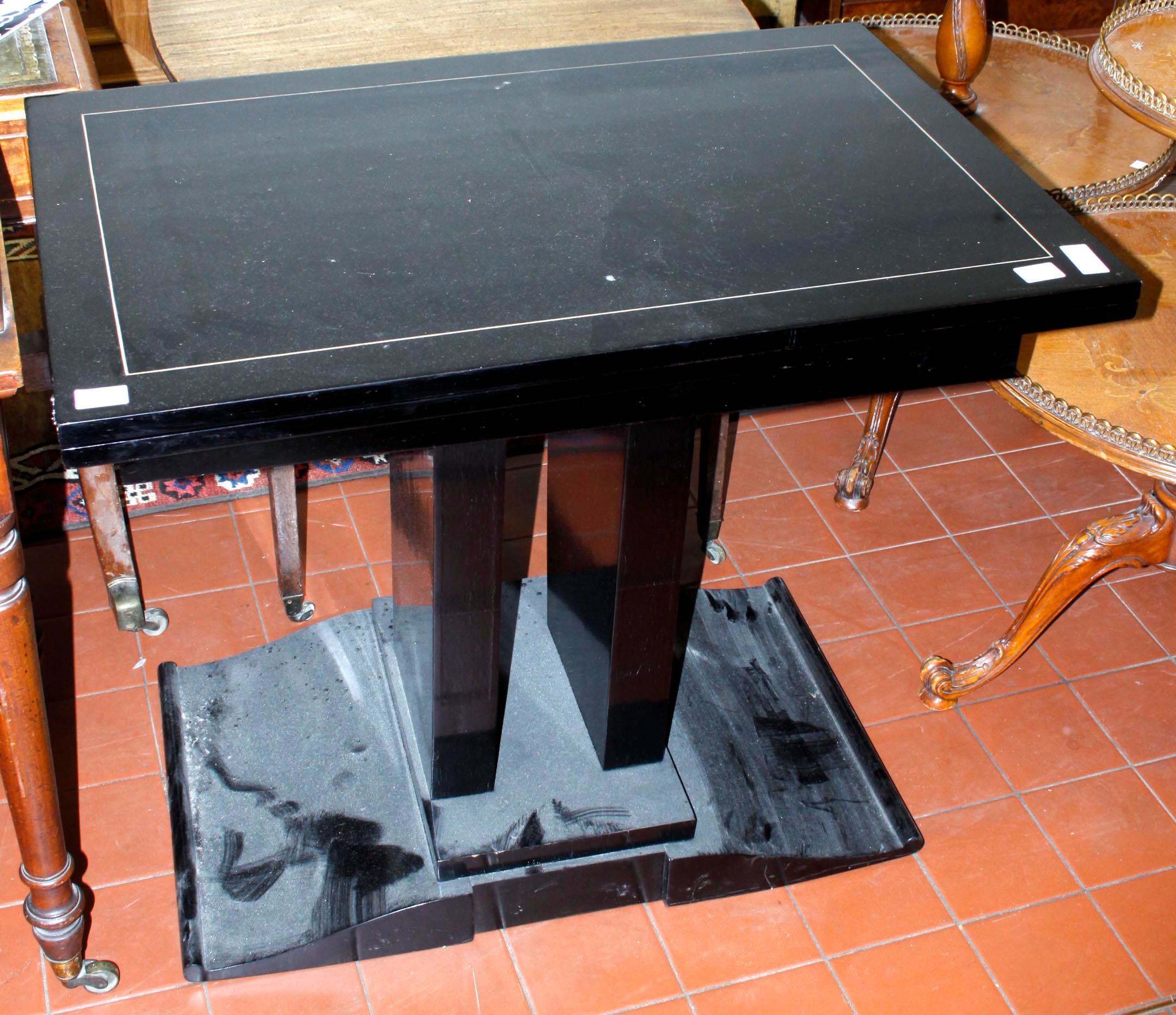 Bonhams : An ebonised rectangular games table, with foldover top, on ...