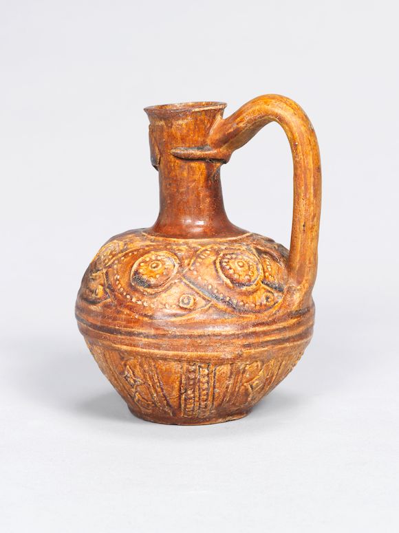 Bonhams : A rare Umayyad/ early Abbasid monochrome moulded pottery Jug ...