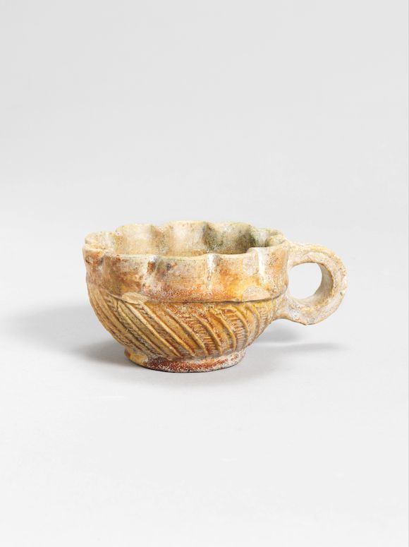 Bonhams : A small Umayyad splashware moulded pottery Cup Mesopotamia or ...