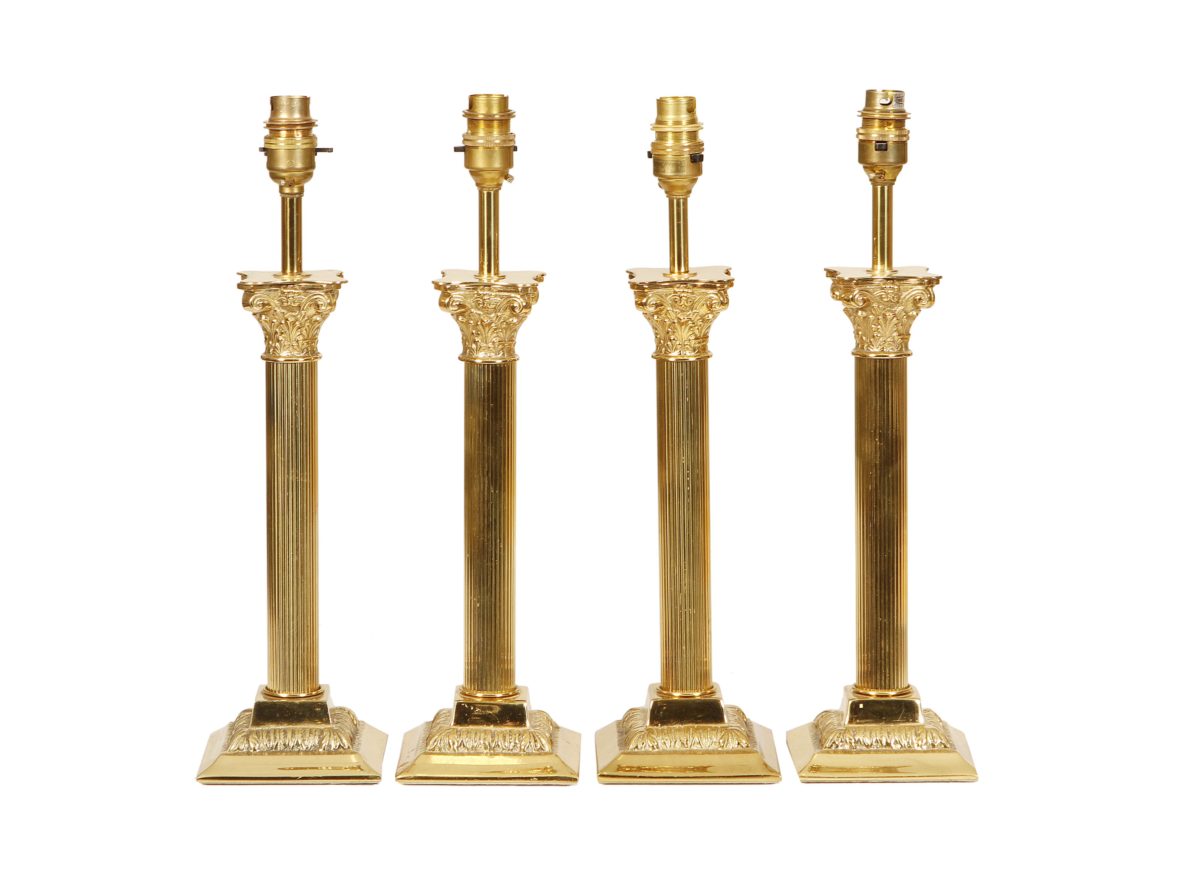 Bonhams : A set of four brass Corinthian column lamp bases