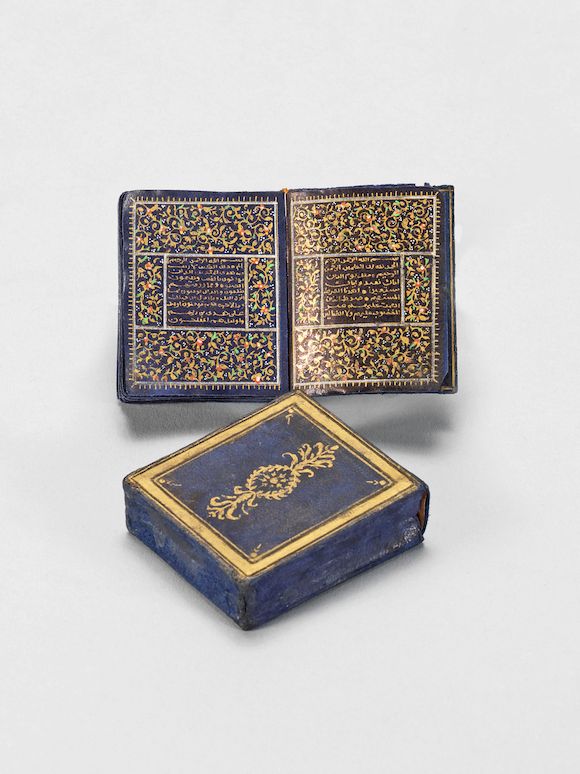 Bonhams : A miniature Qur'an written in gold on blue paper probably ...