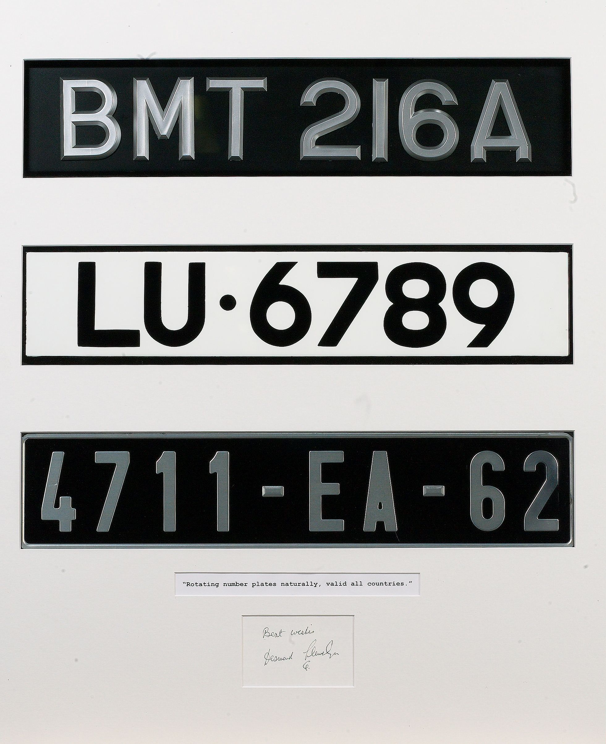 Bonhams Cars : A display of three 'rotating' number plates,