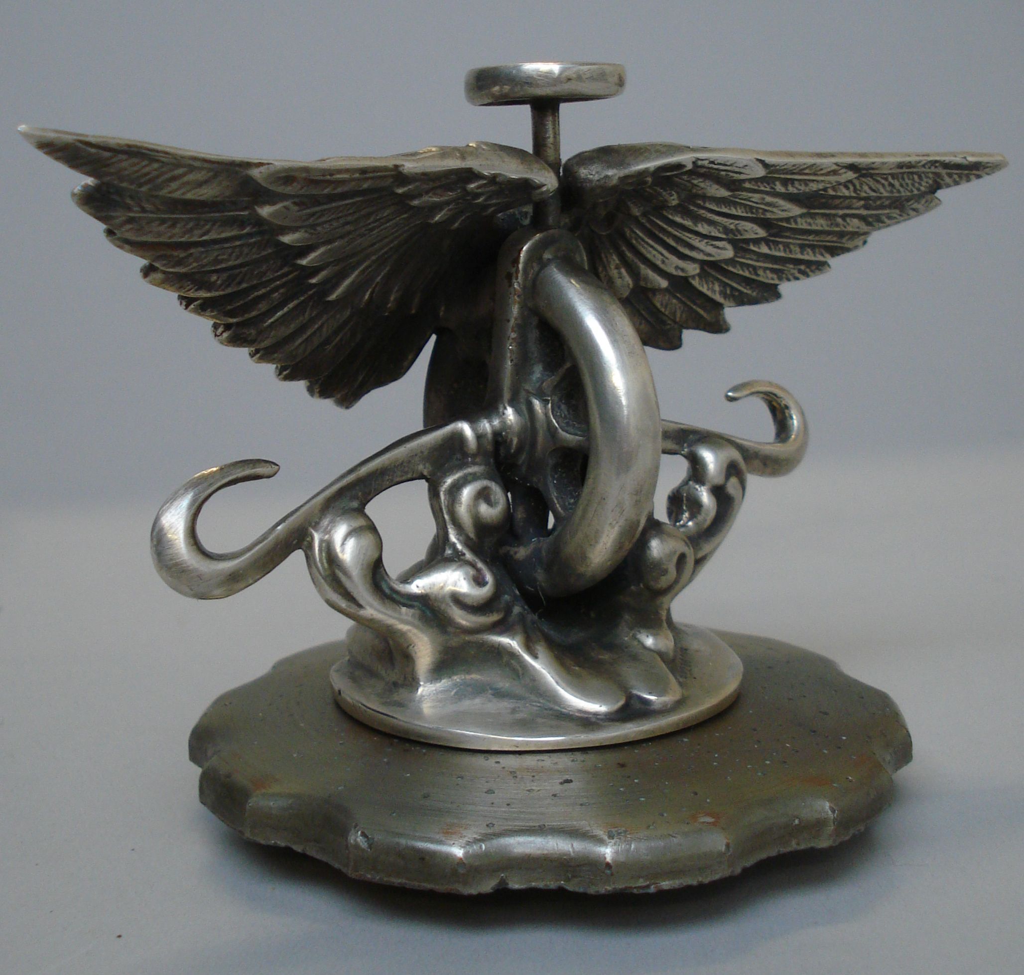 Bonhams Cars : An Austin winged wheel mascot,