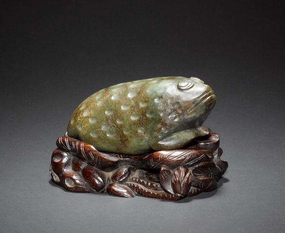 Bonhams : A green jade figure of a three-legged mythical toad; in a ...
