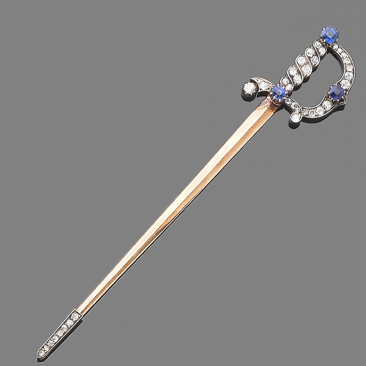 Bonhams : A diamond and sapphire sword pin,