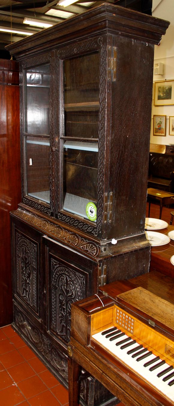 Bonhams : A carved oak bookcase,