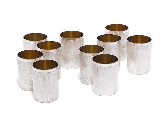 Bonhams : GERALD BENNEY: A set of ten small silver beakers, by GERALD ...
