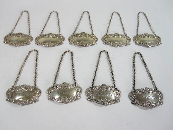 Bonhams : A collection of nine silver wine labels