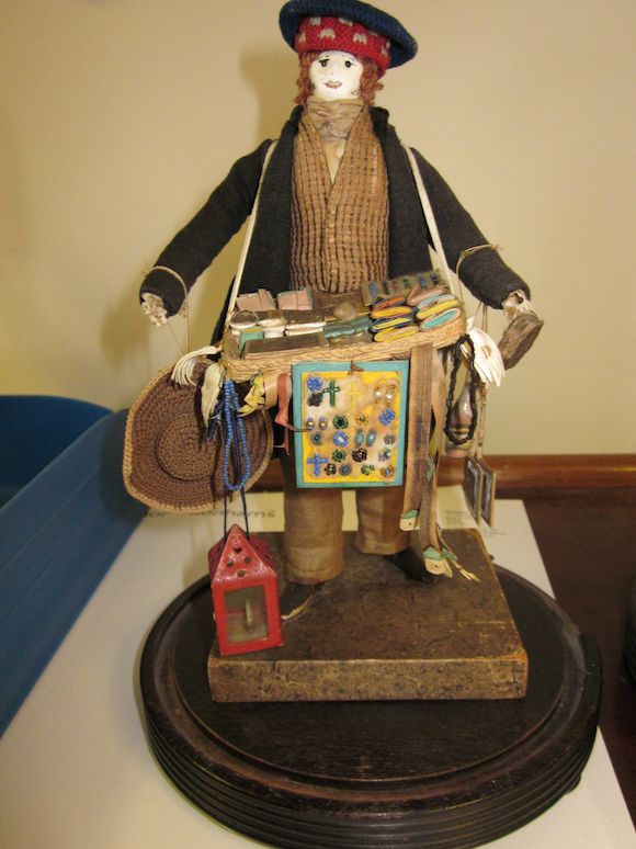 Bonhams : Pair of early peddler dolls under glass domes, circa 1830