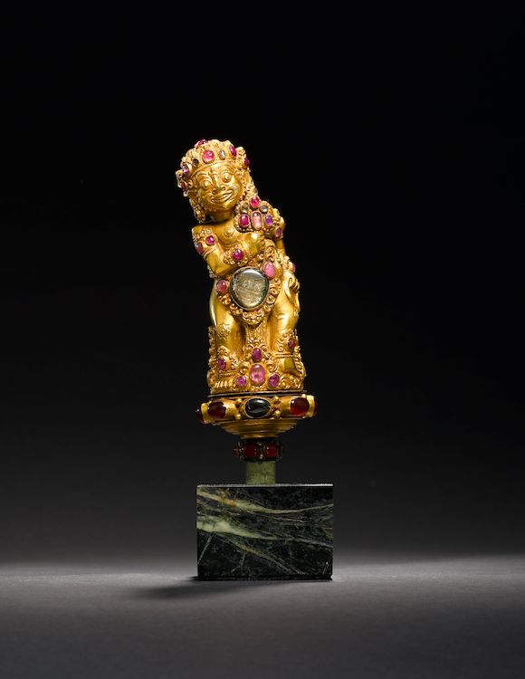 Bonhams : A Nepalese gilt-bronze and inlaid sceptre head with a cast ...