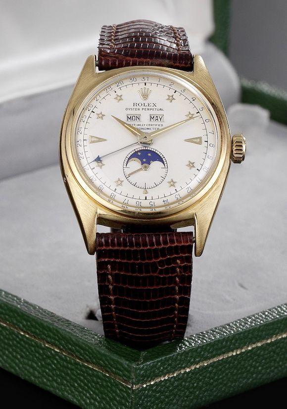 Bonhams : Rolex. A fine and rare 18ct gold triple calendar wristwatch ...
