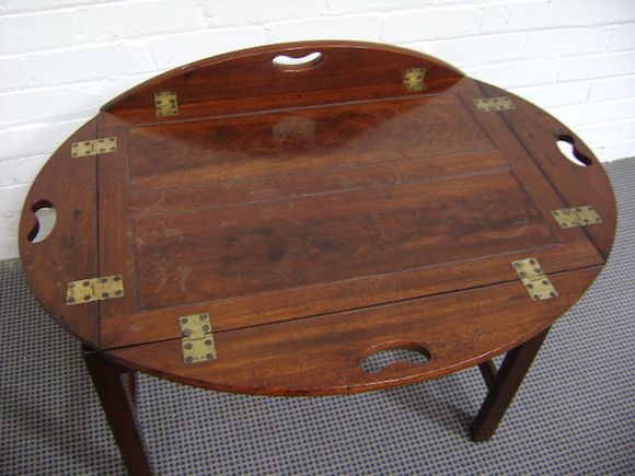 Bonhams : A late Georgian mahogany butlers tray, the four brass hinged ...