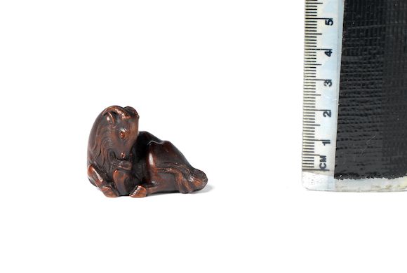 Bonhams : A fine wood netsuke of a recumbent goat By Ikkan (1817-1893 ...