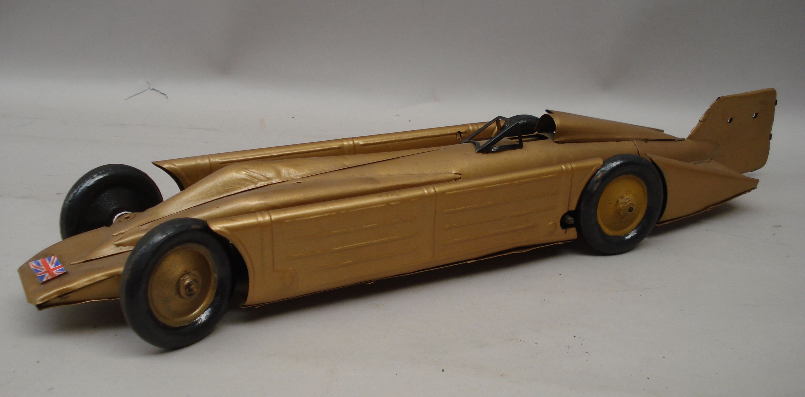 Bonhams Cars : A tinplate Golden Arrow clockwork toy by Guntherman ...