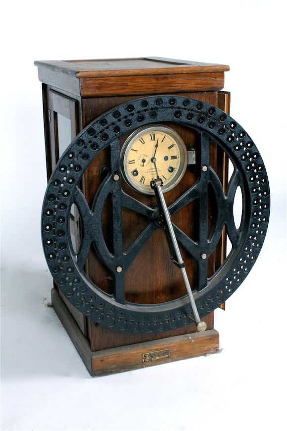 Bonhams : An oak cased 'International Time Recording' device.