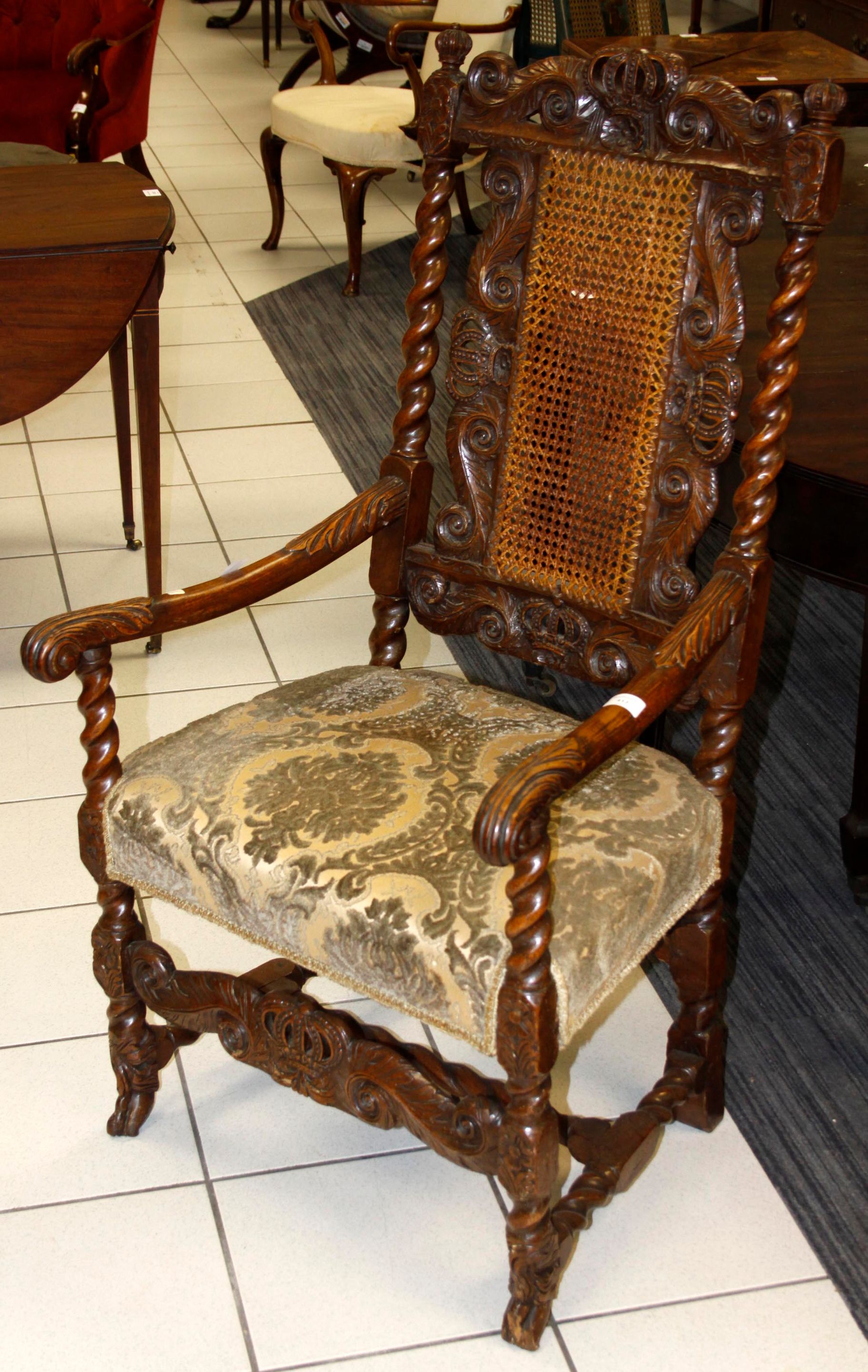 Bonhams : A Carolean style carved walnut elbow chair,