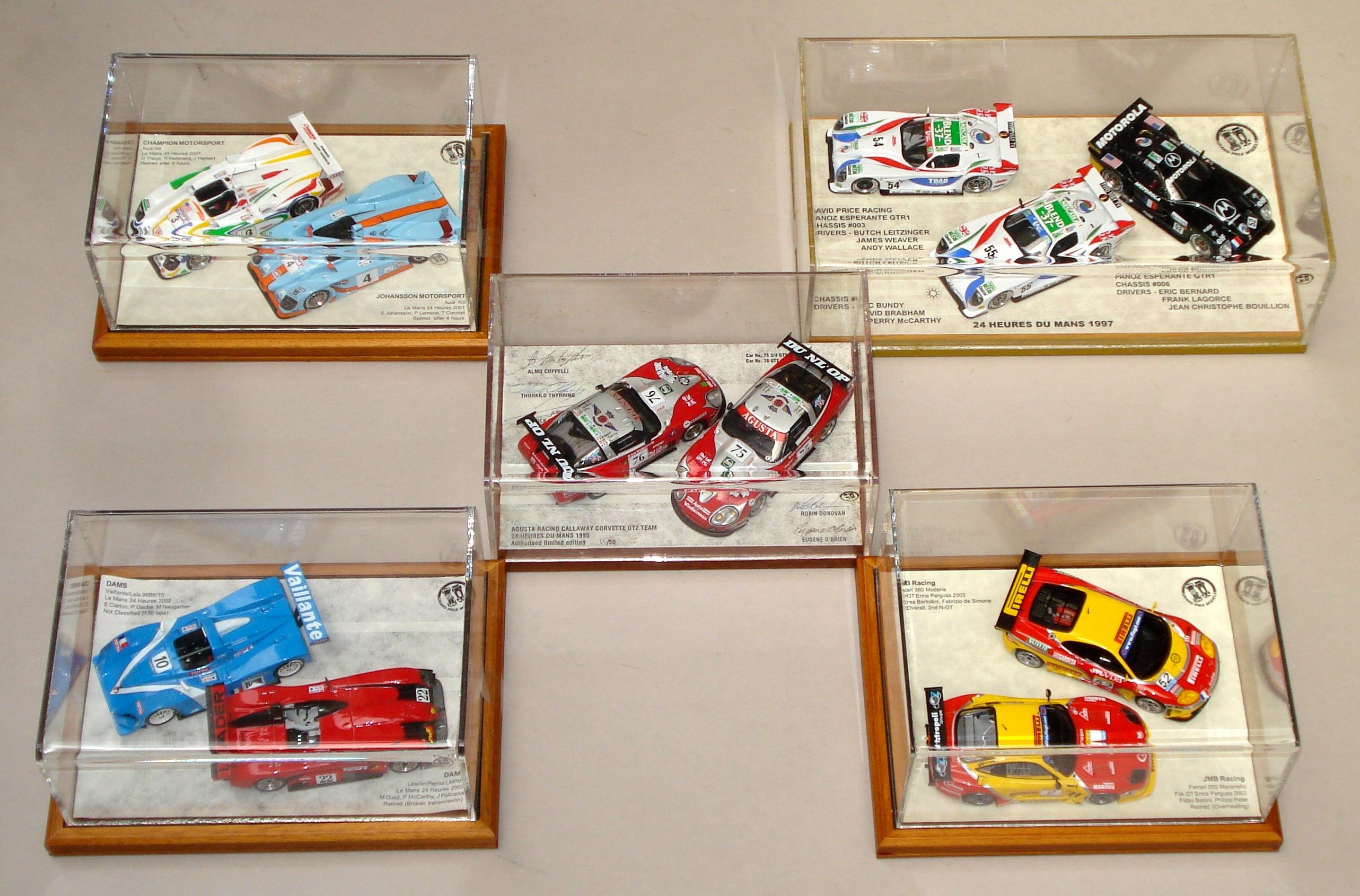 Bonhams Cars : A collection of eleven white metal models mounted within ...