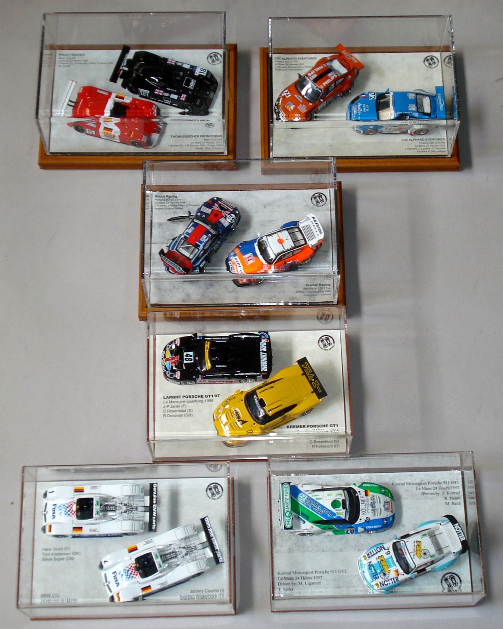 Bonhams Cars : A collection of twelve white metal models mounted within ...