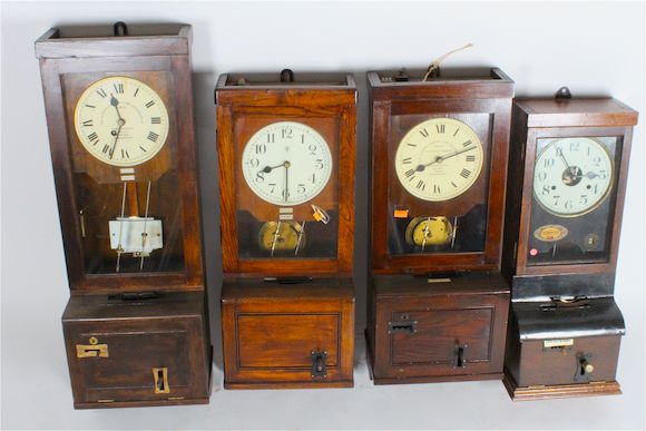 Bonhams : Four various oak clocking-in machines