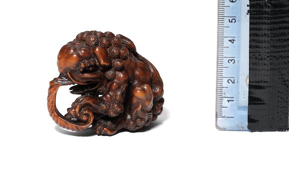 Bonhams : A rare wood netsuke of a baku 19th century