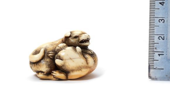 Bonhams : An ivory netsuke of two dogs By Okakoto, Kyoto, early 19th ...