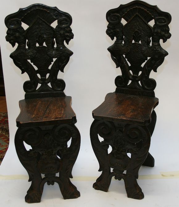 Bonhams : A pair of Italian carved walnut hall chairs