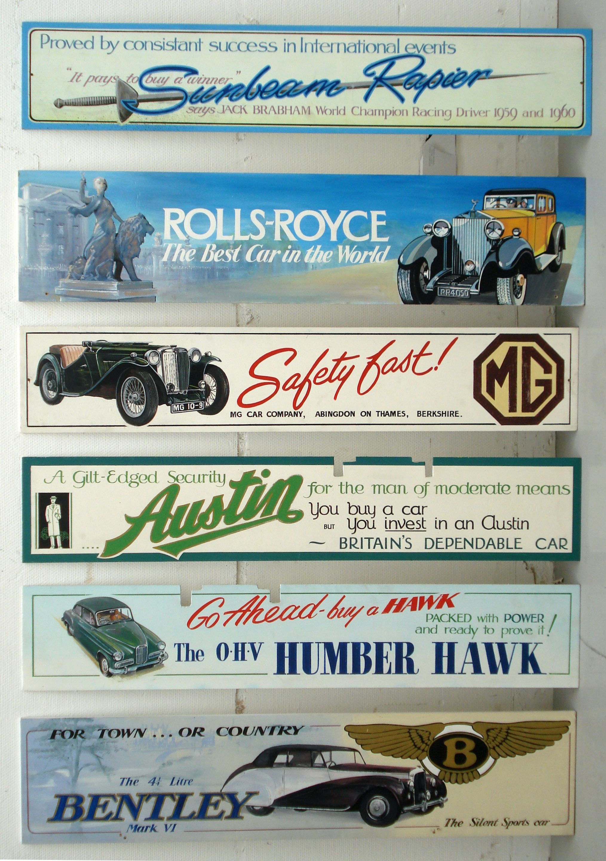 Bonhams Cars : A collection of wooden advertising signs for different ...