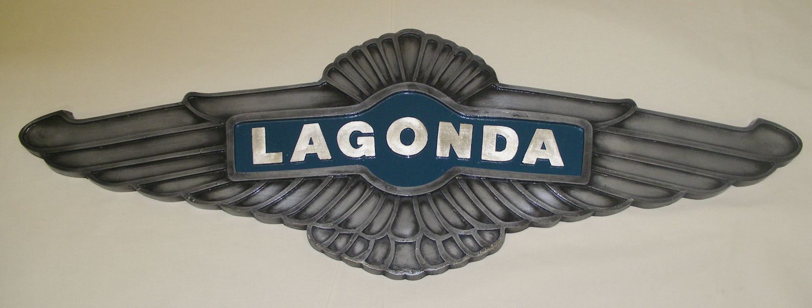 Bonhams Cars : A cold-cast aluminium Lagonda badge,