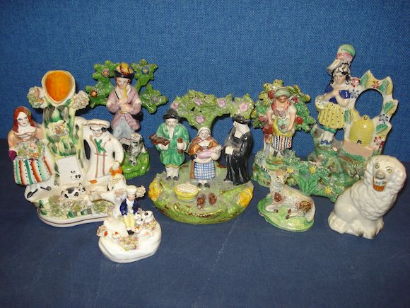 Bonhams : A Staffordshire 'tythe pig' figure group