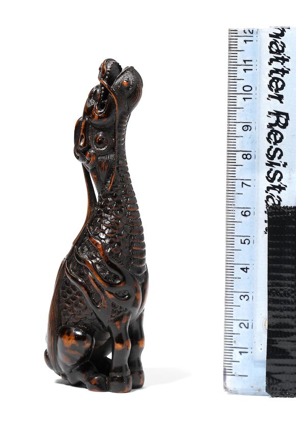 Bonhams : A wood netsuke of a seated kirin By Issho, late 19th/early ...