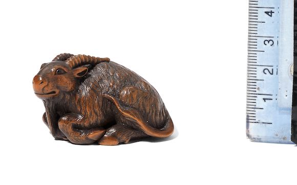 Bonhams : A boxwood netsuke of a recumbent goat By Kokei, early 19th ...