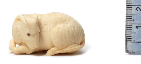 Bonhams : A fine ivory netsuke of a recumbent goat By Kaigyokusai ...