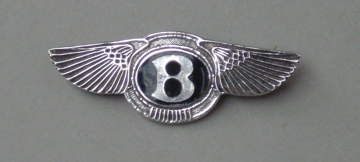 Bonhams Cars : A Bentley Winged B lapel badge,