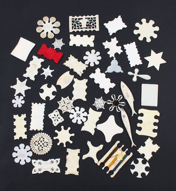 Bonhams : A mixed group of ivory and bone thread winders