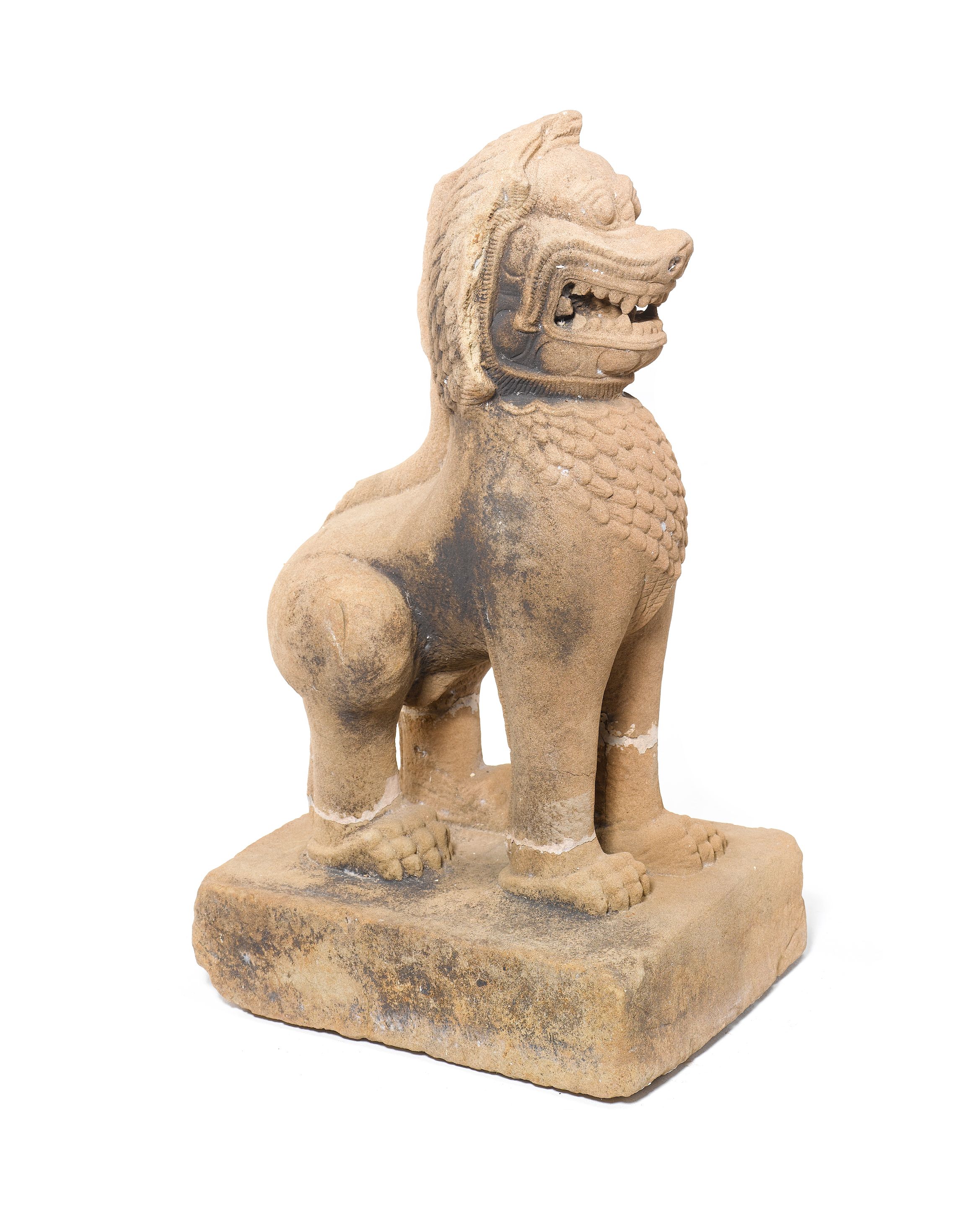 Bonhams : A Chinese Ming Dynasty sandstone temple dog