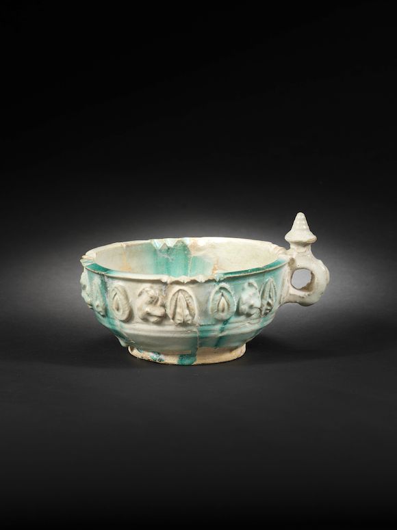 Bonhams : An Abbasid moulded splashware pottery Cup Mesopotamia or ...