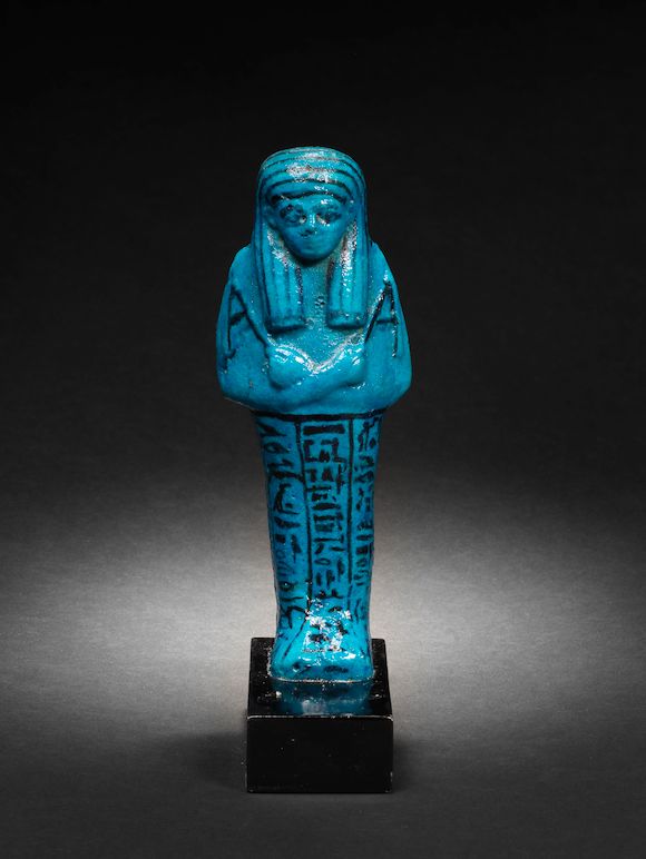 Bonhams : An Egyptian bright blue glazed composition shabti