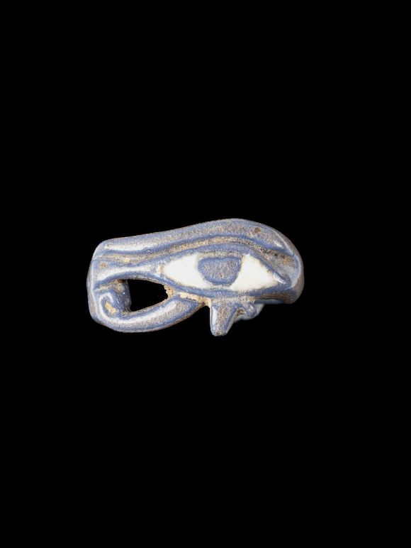 Bonhams : An Egyptian glazed composition udjat eye ring